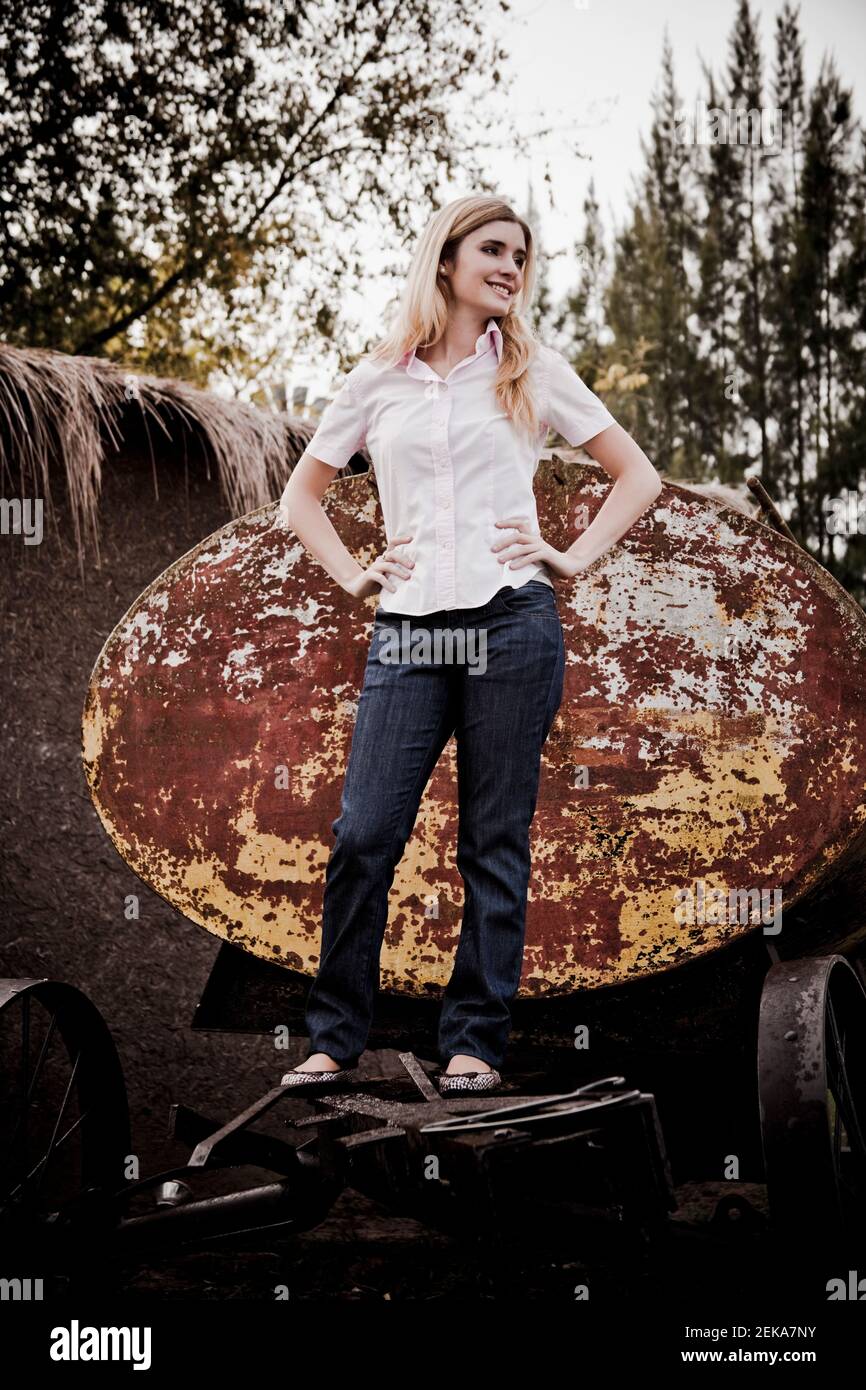 Woman standing on a vehicle trailer Stock Photo - Alamy