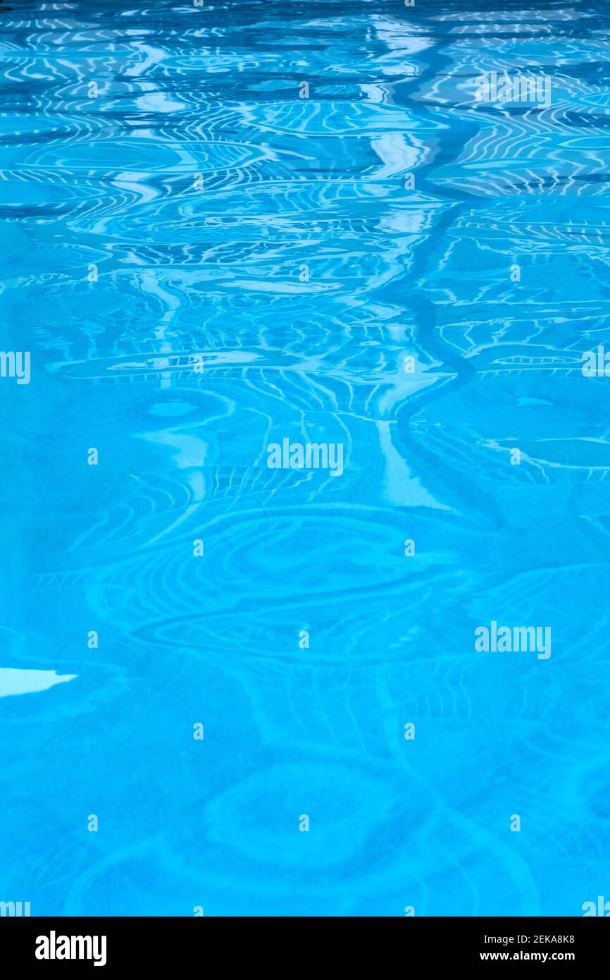 Clear blue water in swimming pool Stock Photo - Alamy