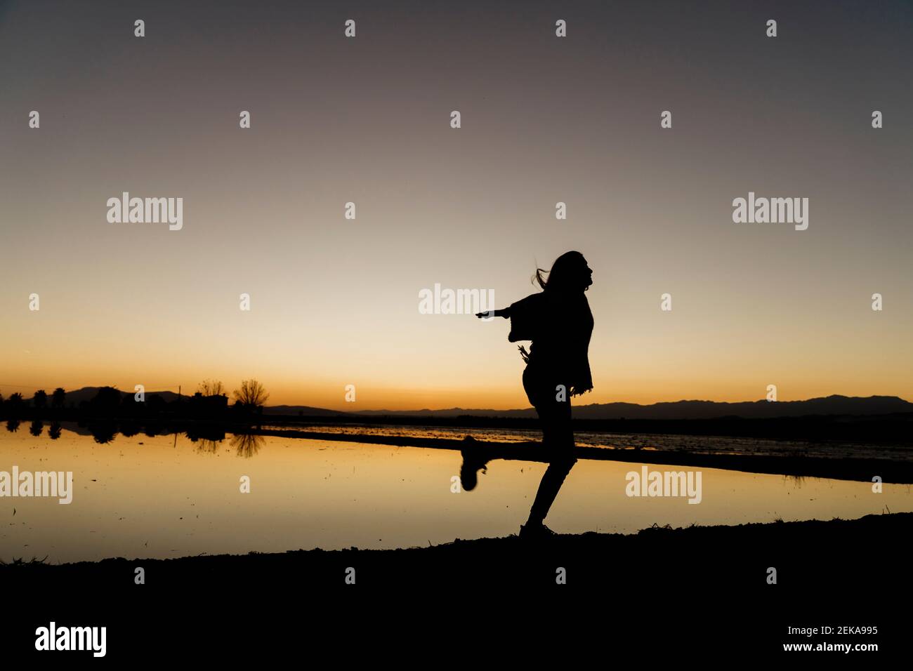 Woman twirling at sunset hi-res stock photography and images - Alamy