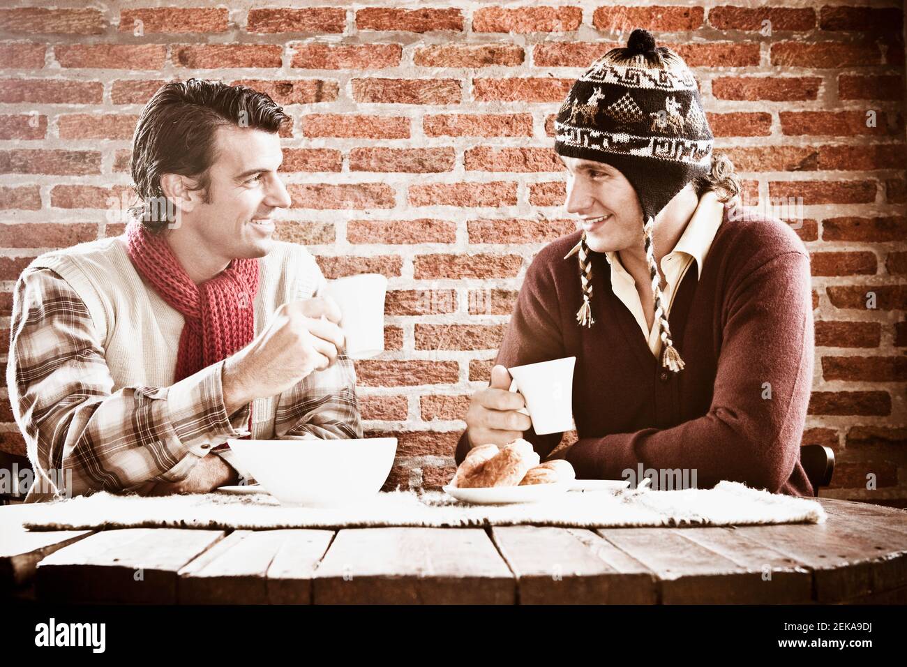 Two friends drinking coffee in a restaurant Stock Photo - Alamy
