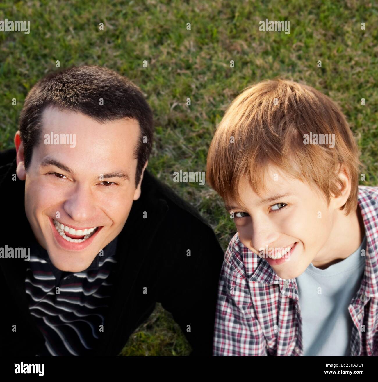 Portrait of a boy smiling with his father Stock Photo - Alamy
