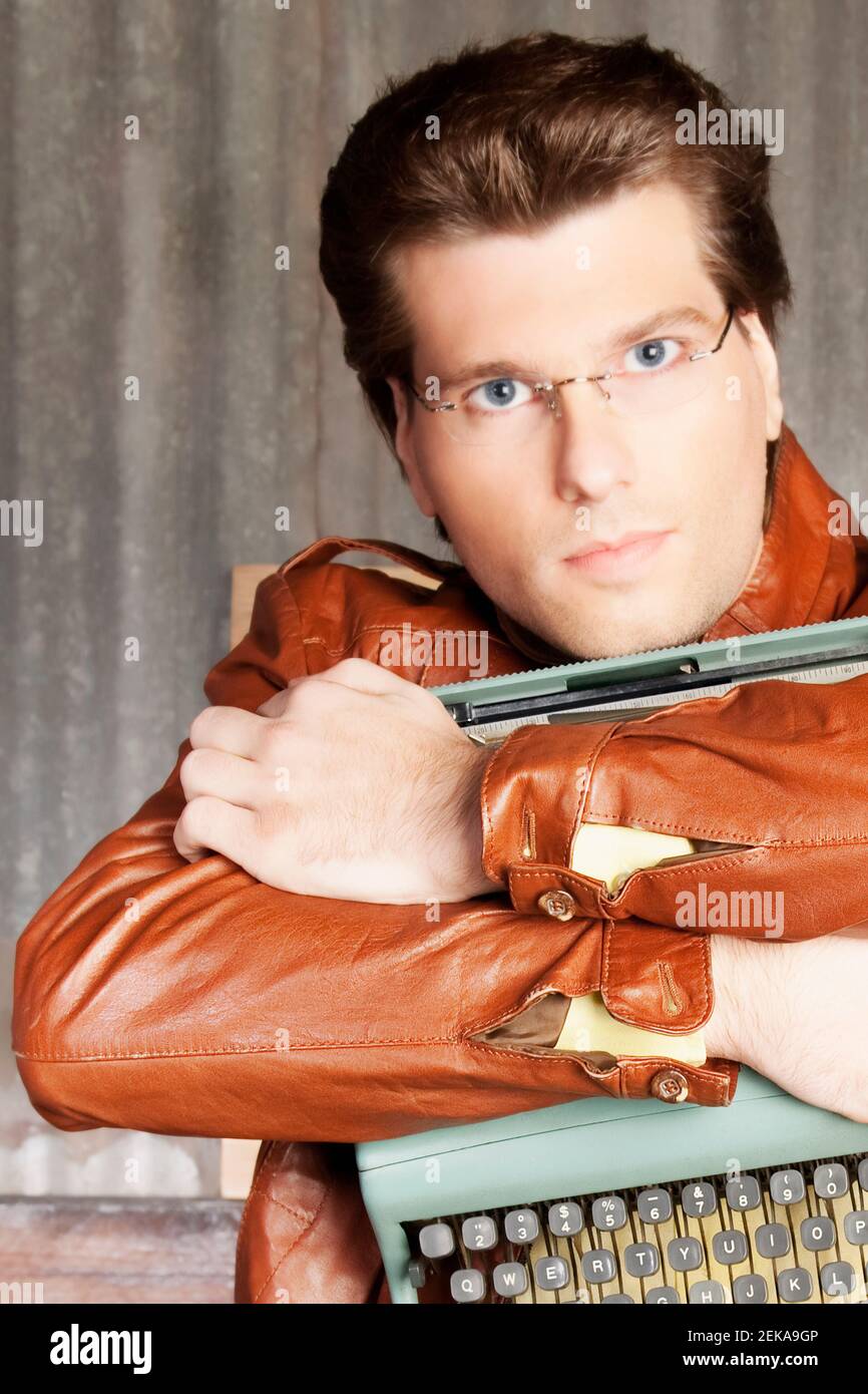 Man carrying a typewriter Stock Photo - Alamy