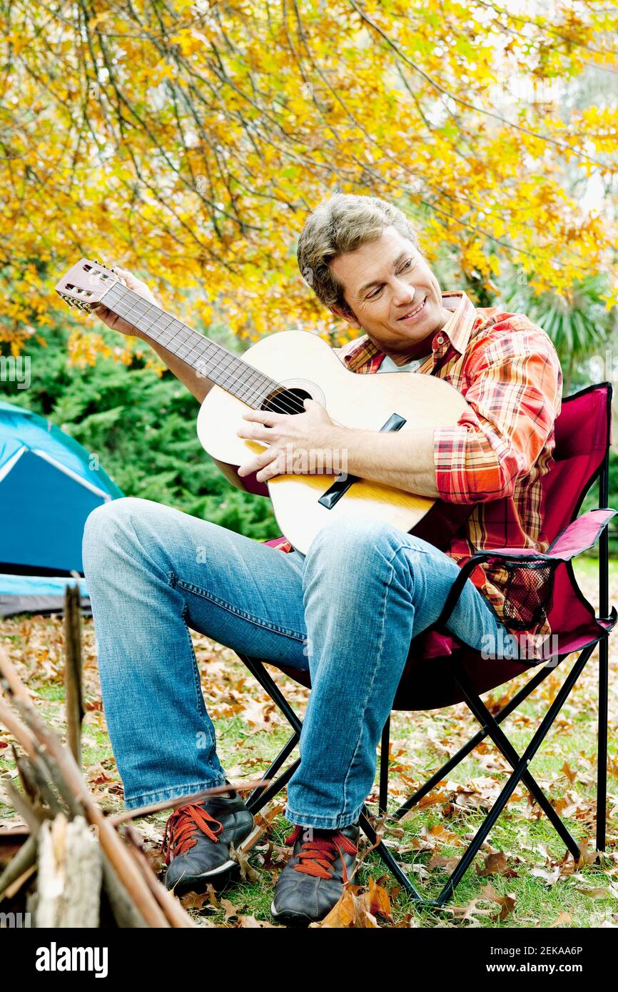 Man playing a guitar Stock Photo - Alamy