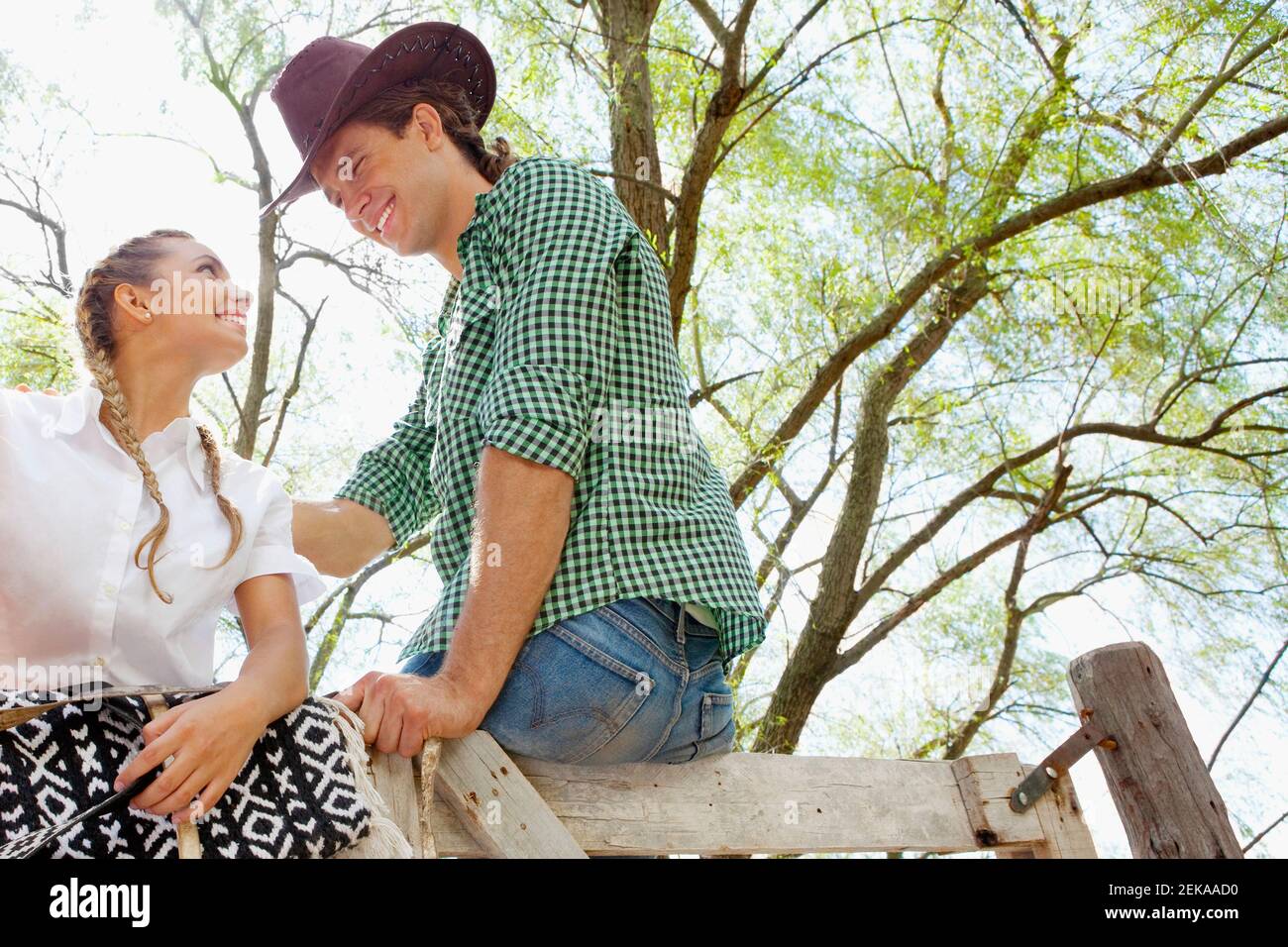 Couple smiling at a ranch Stock Photo - Alamy