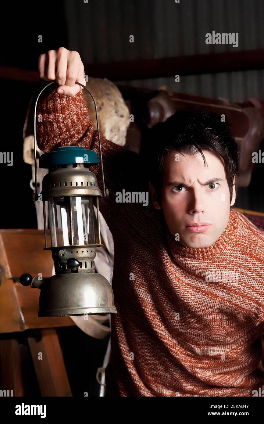 Man holding a lantern hi-res stock photography and images - Alamy