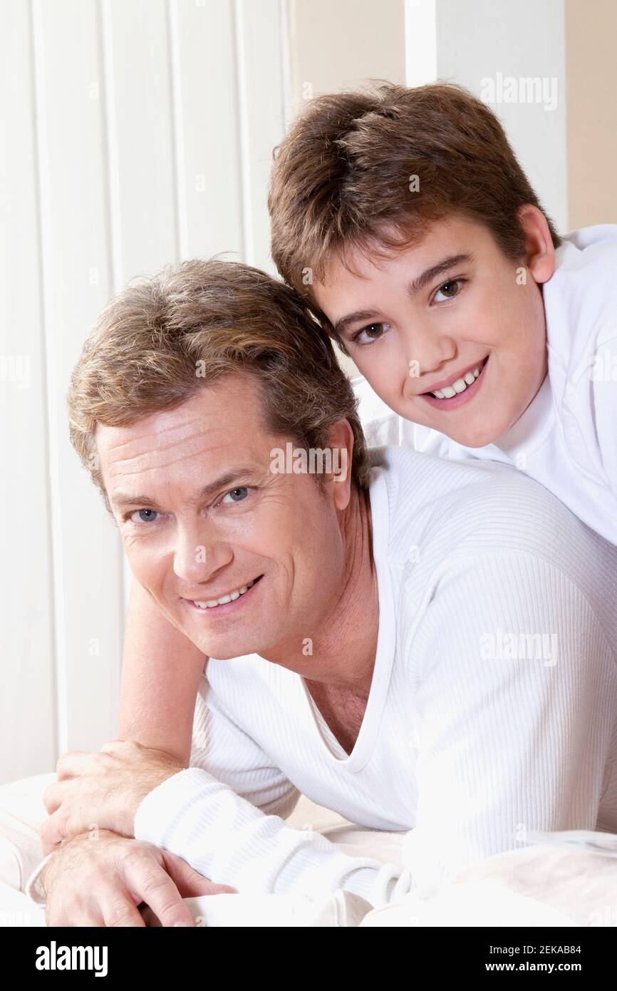 Boy smiling with his father Stock Photo - Alamy