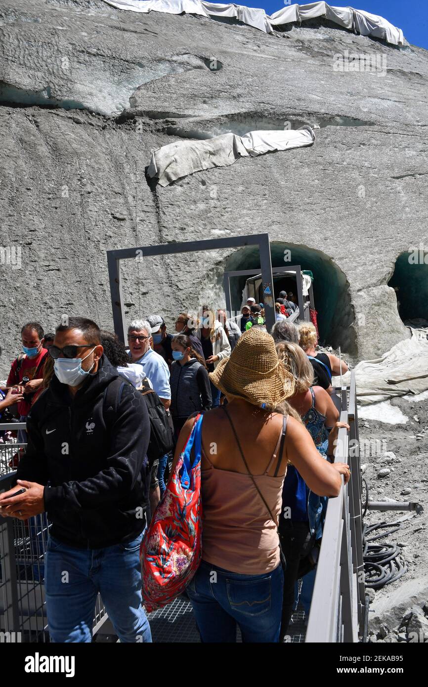 People visit the Chamonix Ice Cave is a cave excavated every year in ...