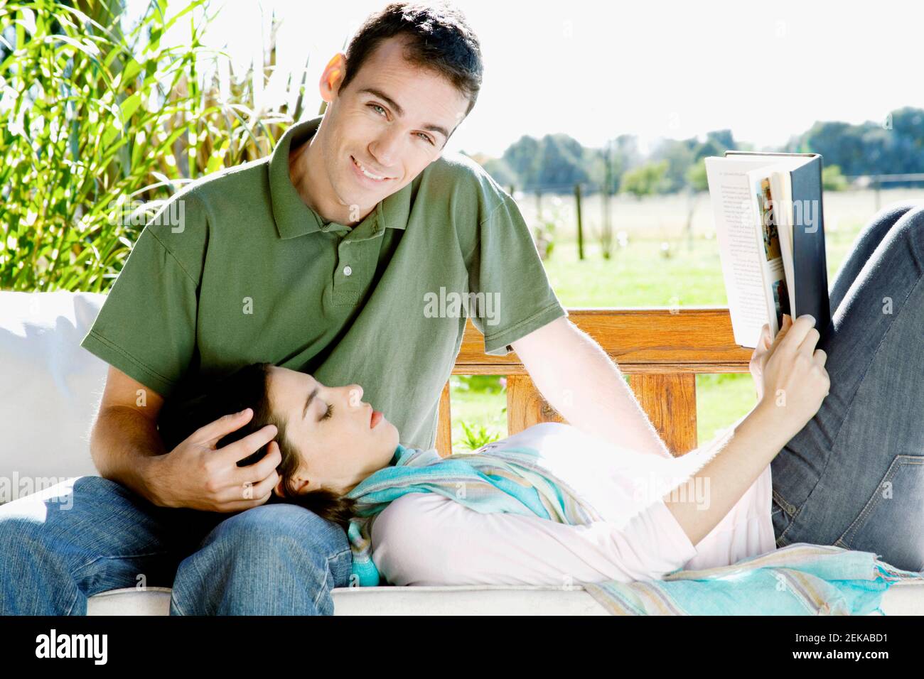 Man holding girlfriend on lap hi-res stock photography and images - Alamy