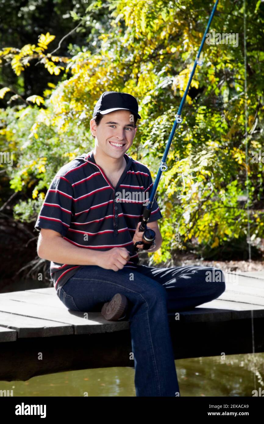 Man fly fishing in a river Stock Photo - Alamy