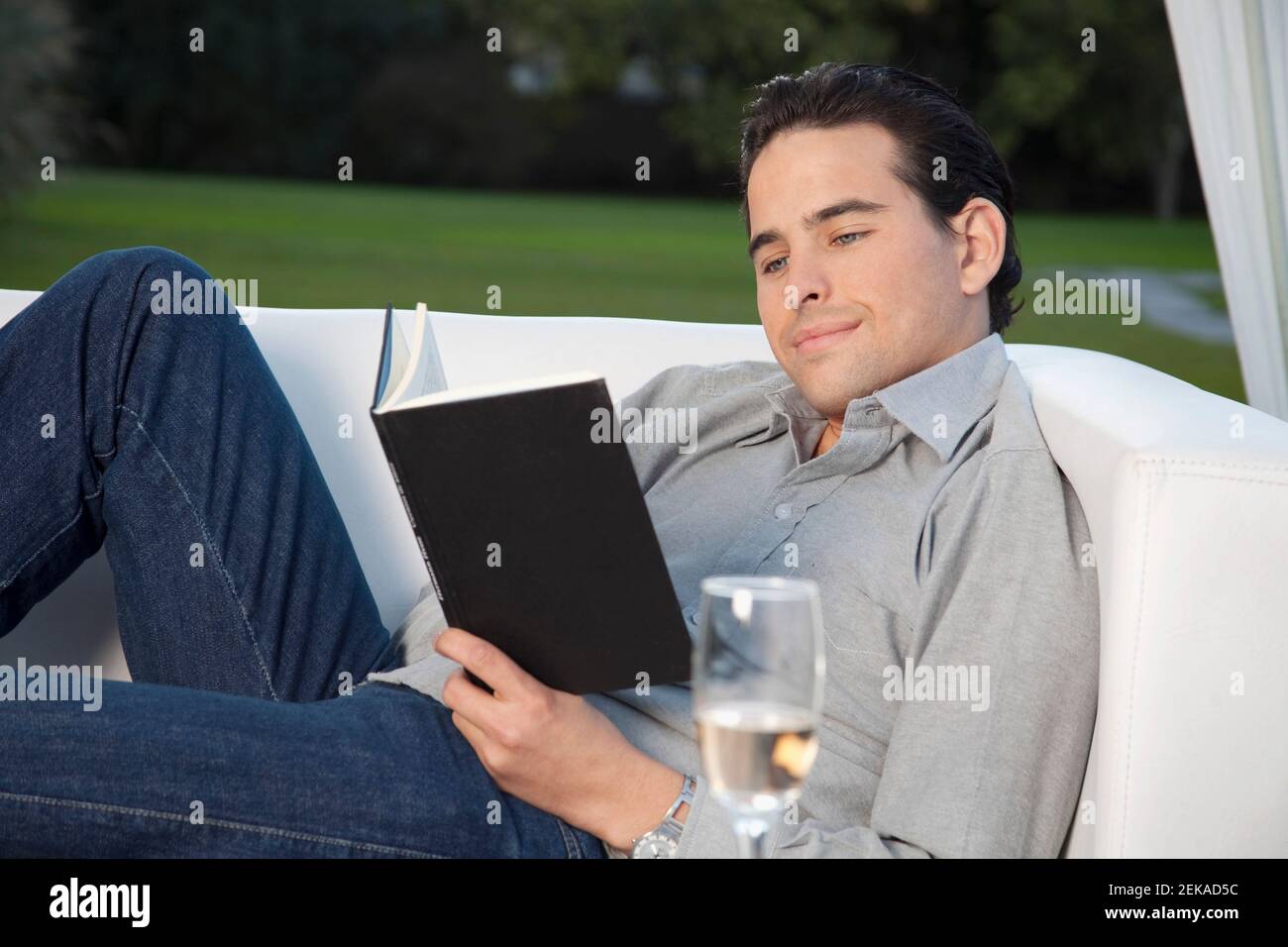 Man reading a book Stock Photo - Alamy