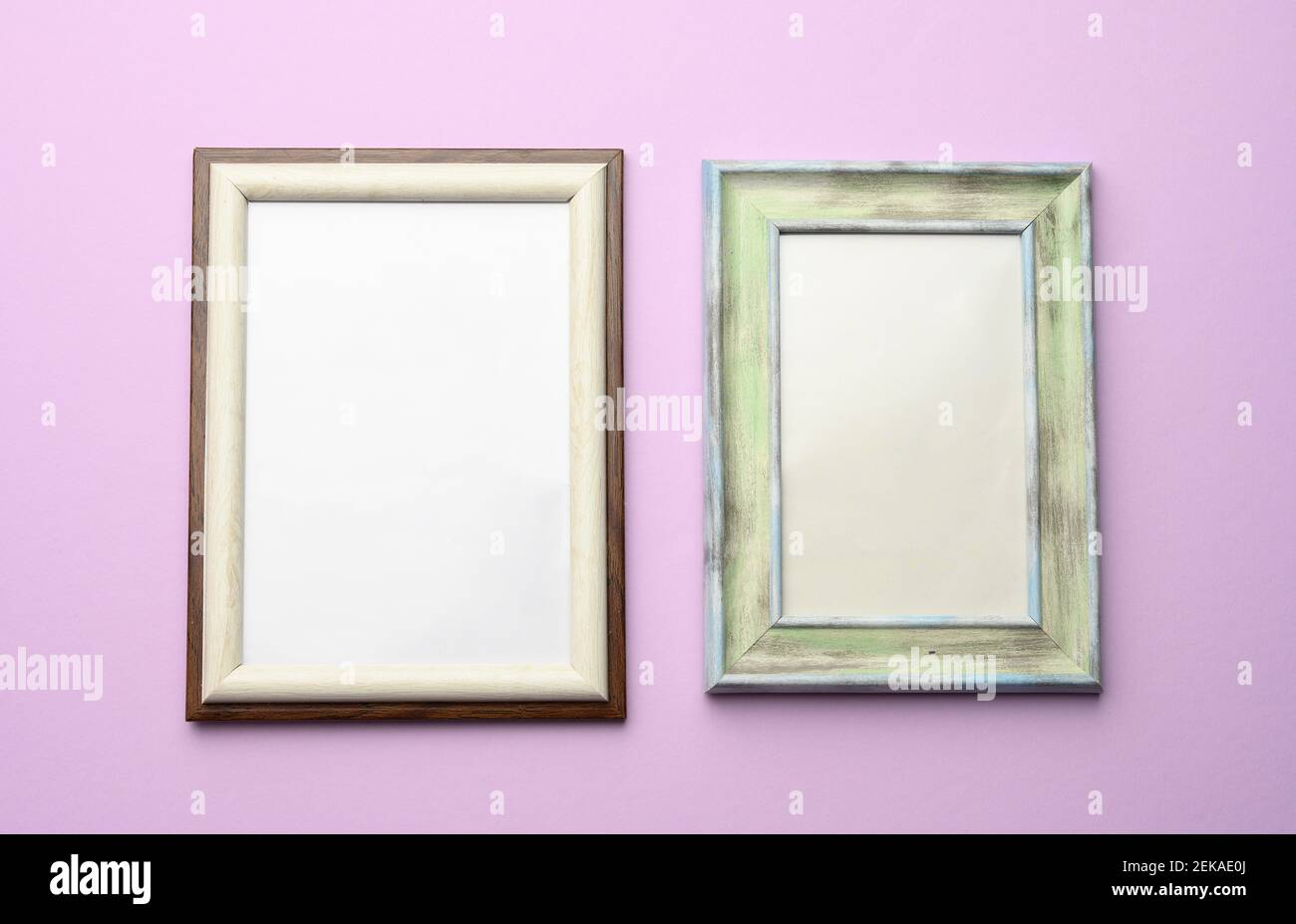 empty rectangular blank wooden frame, purple background, copy space ...