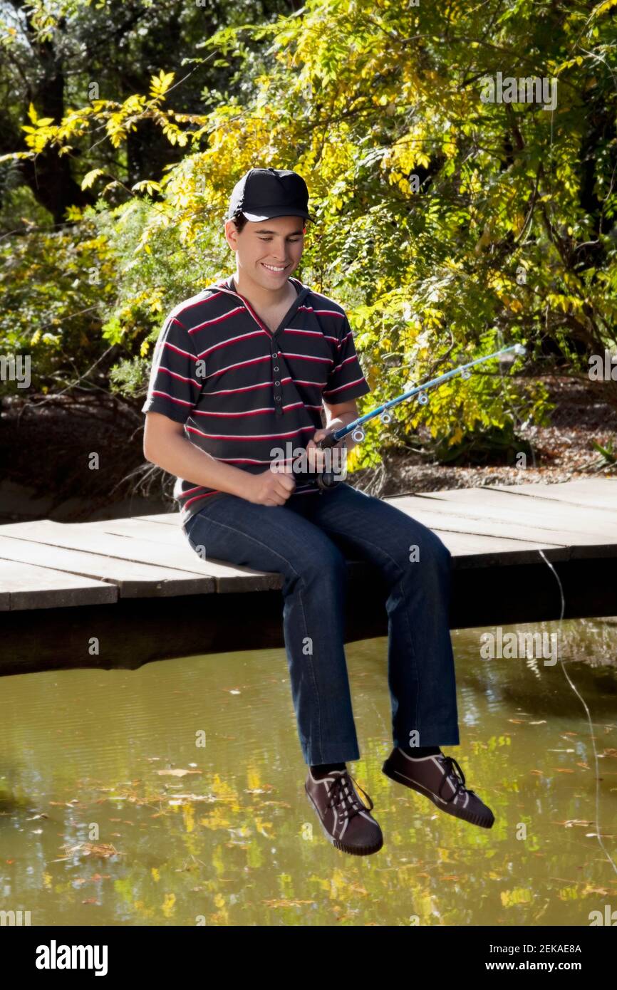 Man fly fishing in a river Stock Photo - Alamy