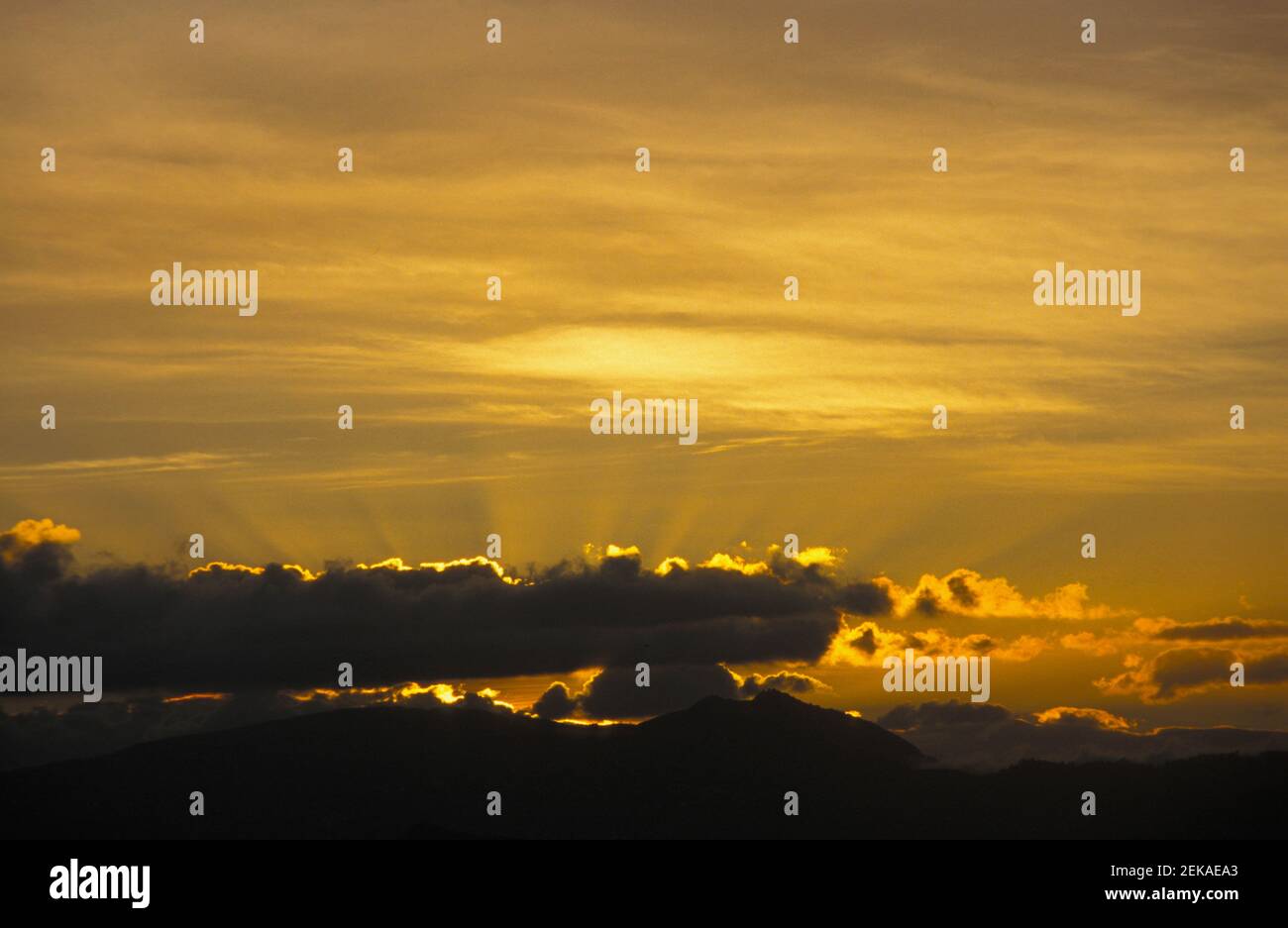 Sunbeam behind clouds over hi-res stock photography and images - Alamy