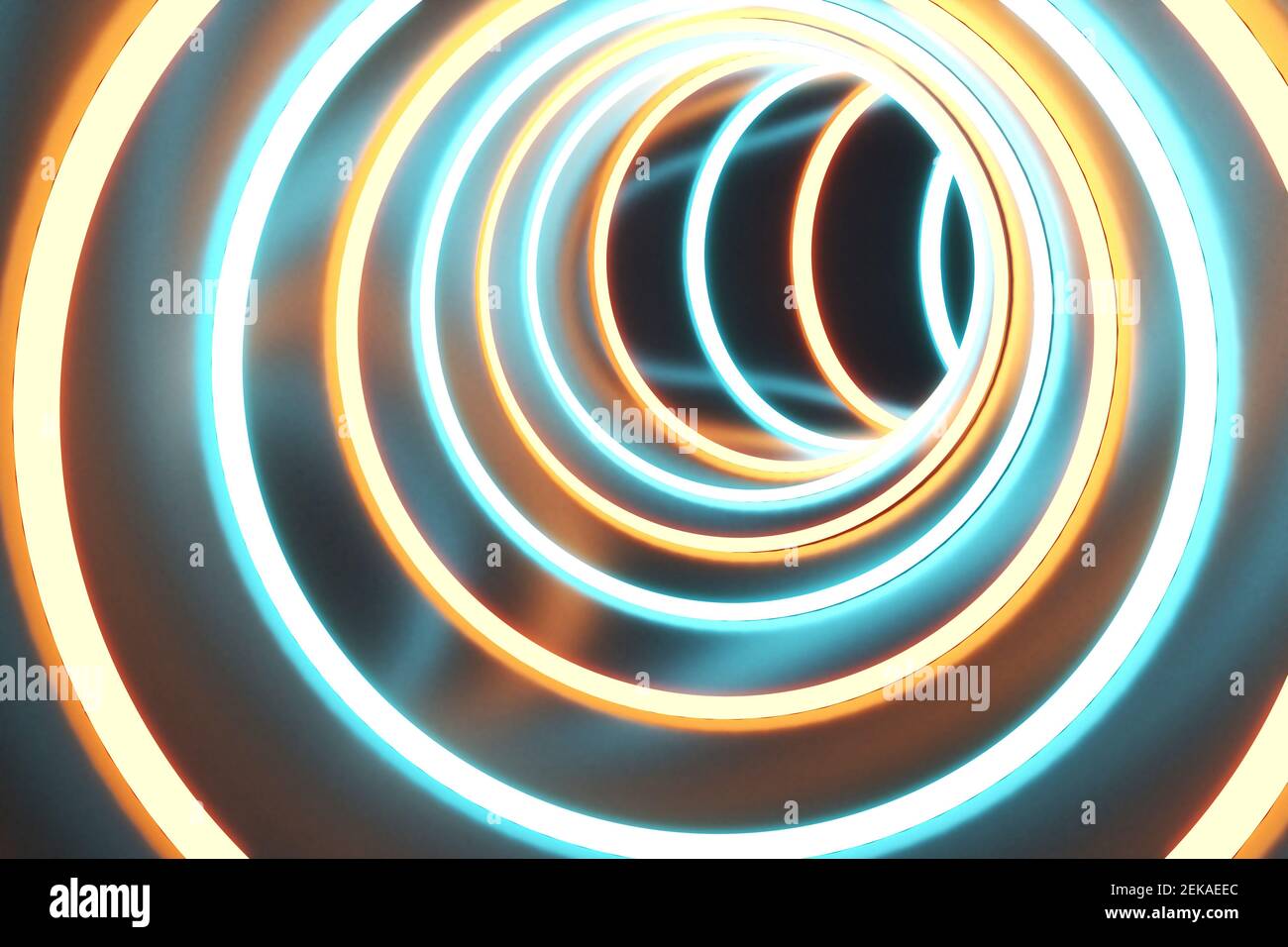 Illuminated blue and yellow circle in neon lighting Stock Photo - Alamy