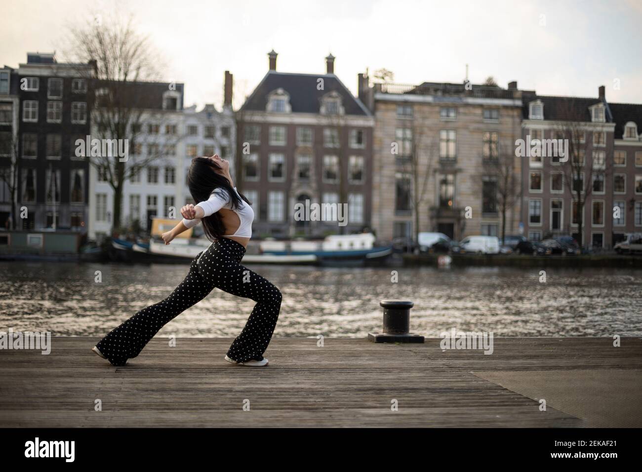 Woman on pier arms hi-res stock photography and images - Alamy