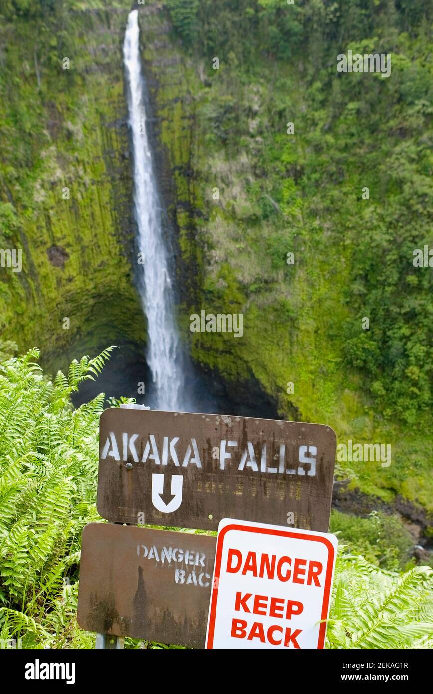 Warning sign with a waterfall in the background, Akaka Falls, Akaka ...