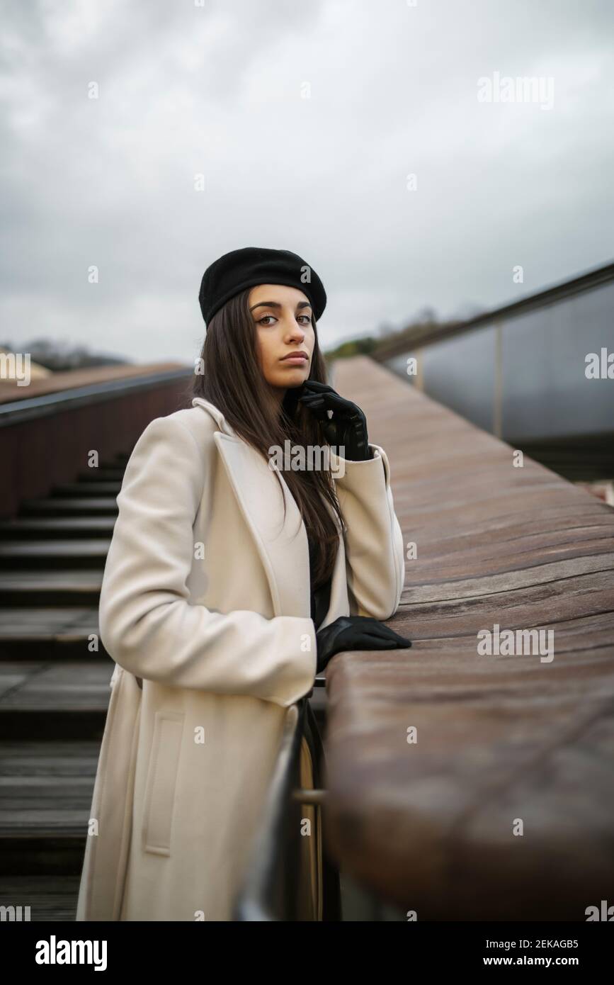 Woman leaning over wall hi-res stock photography and images - Alamy