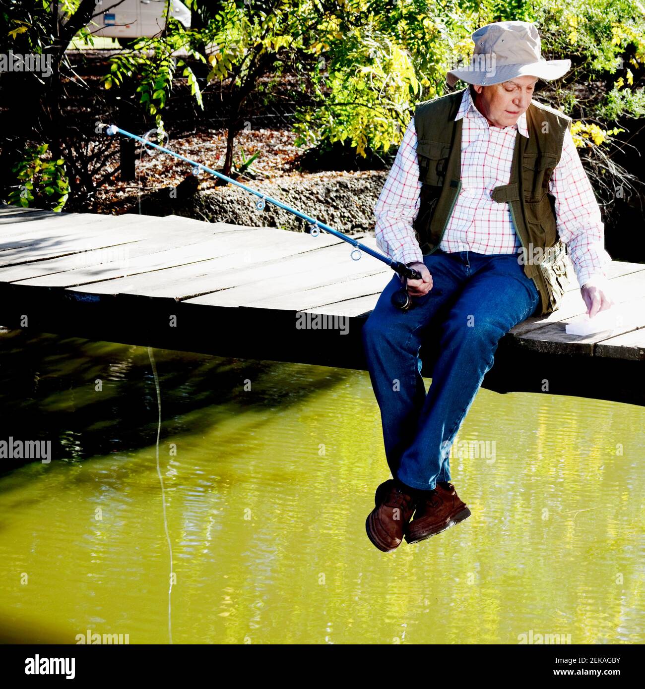 Man fly fishing in a river Stock Photo - Alamy