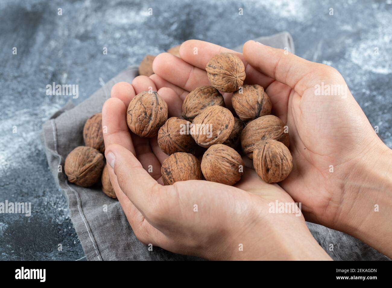 Hand holding nuts hi-res stock photography and images - Alamy
