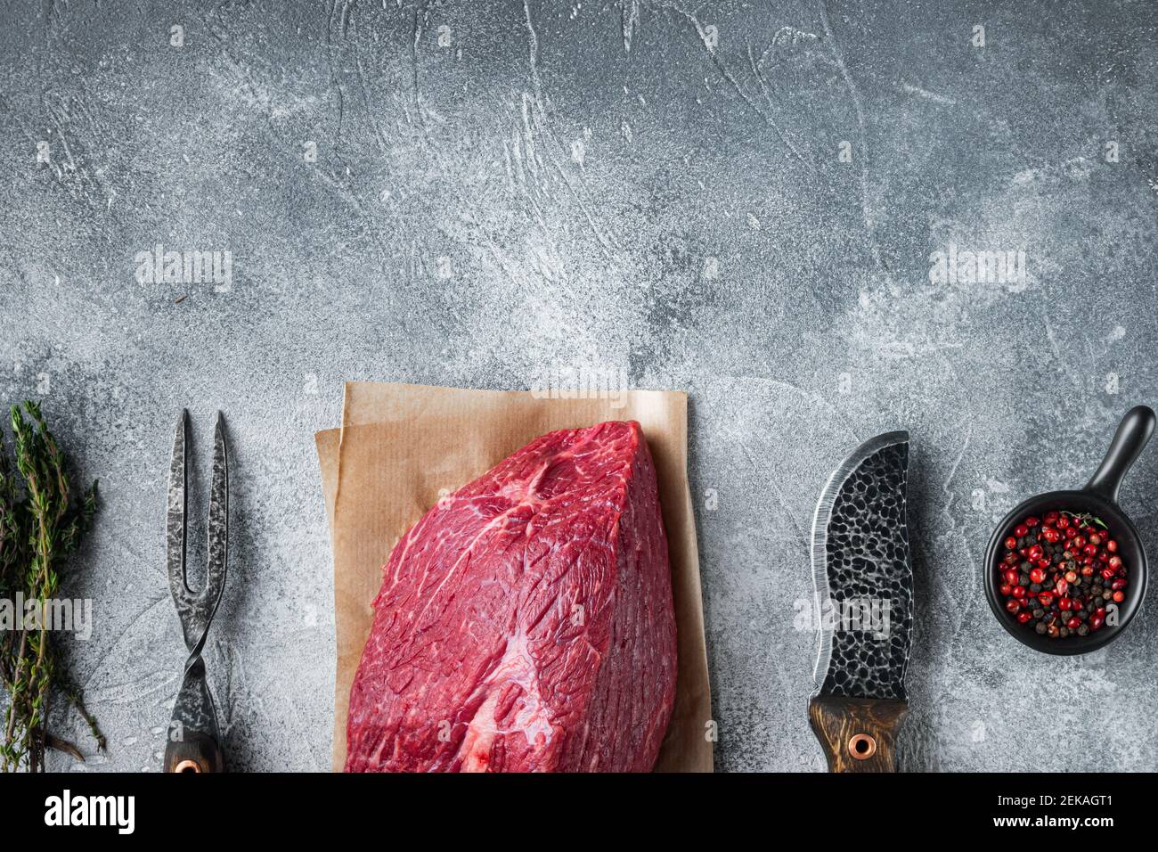 Beef meat cut raw set with old butcher cleaver knife, on gray ...