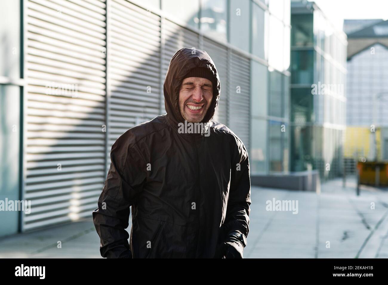 Man in hood and jacket hi-res stock photography and images - Alamy