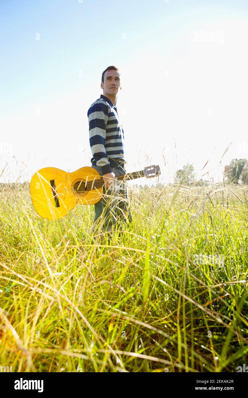 Man guitar over shoulder hi-res stock photography and images - Alamy