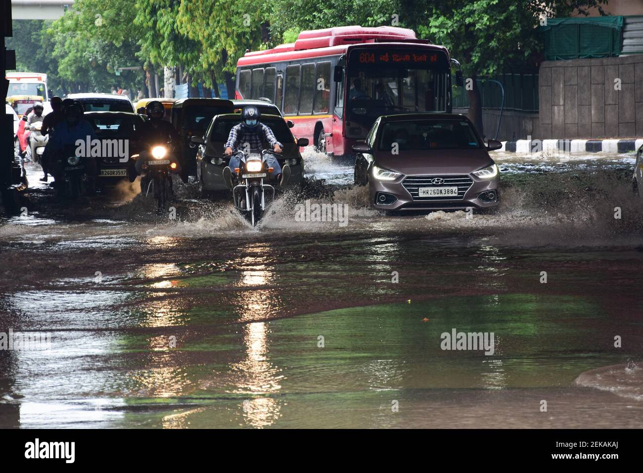 Vehicles seen passing through a heavily waterlogged road after heavy rainfall in Delhi. Heavy ...