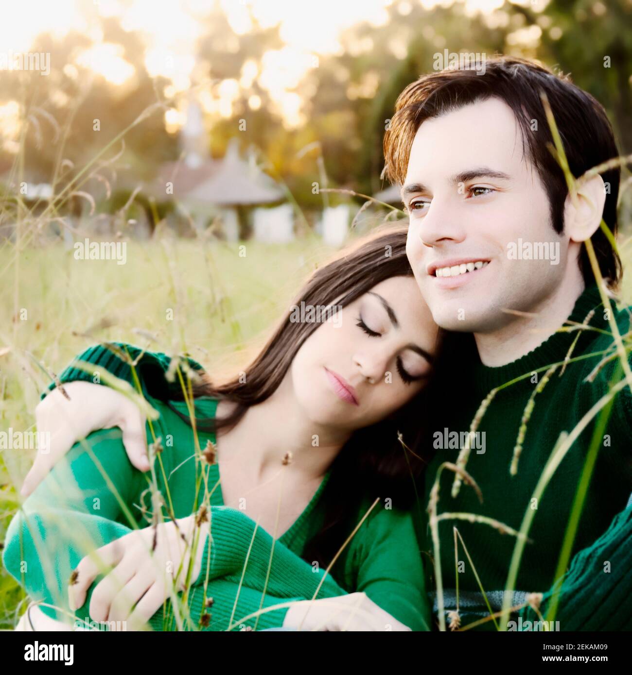 Romantic couple in a field Stock Photo - Alamy