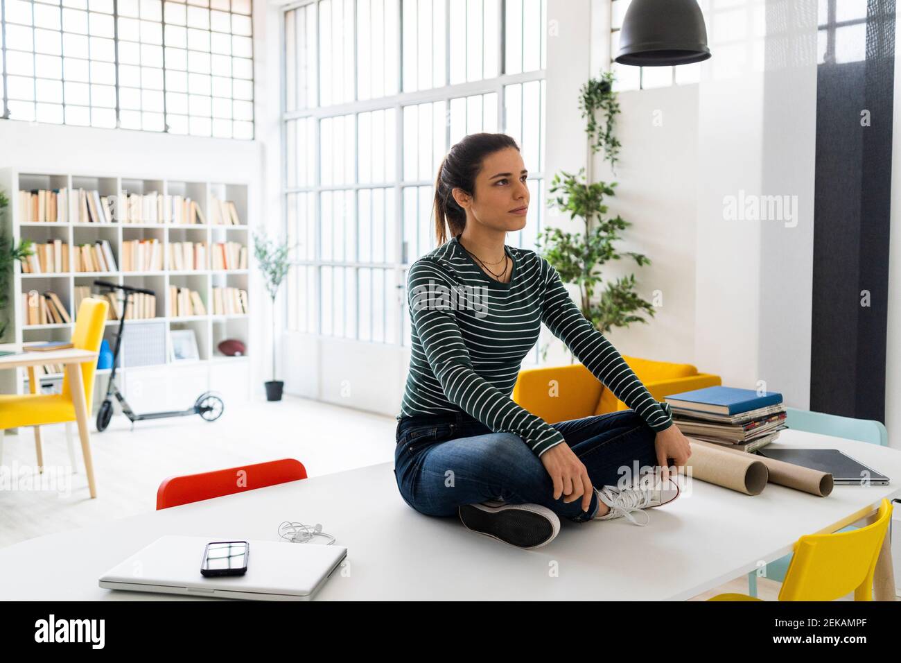 Woman sitting table contemplating hi-res stock photography and images ...