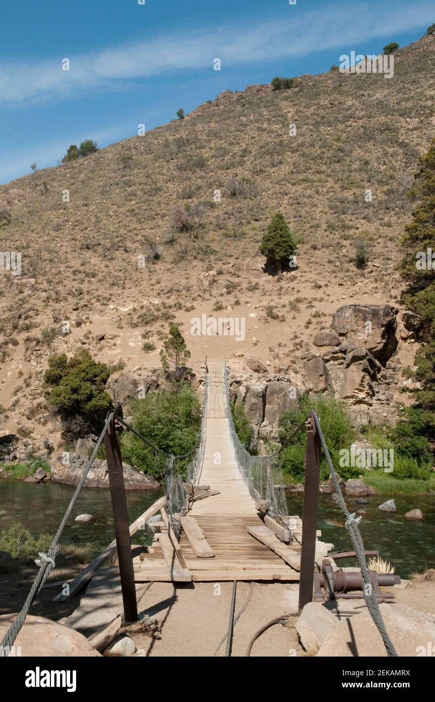 Suspension bridge over a stream, Cordillera de los Andes, Argentina ...