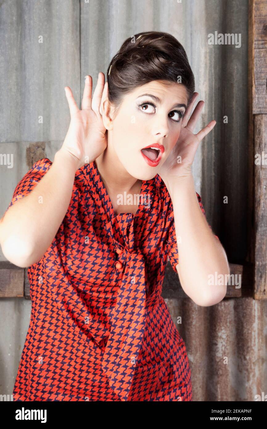 Female cupping her mouth with hand hi-res stock photography and images ...