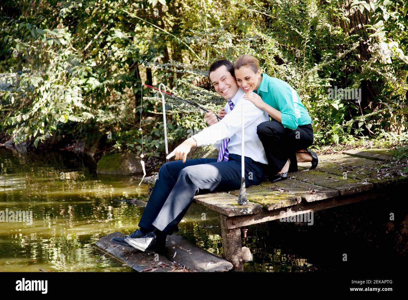 Couple fly fishing in a river Stock Photo - Alamy