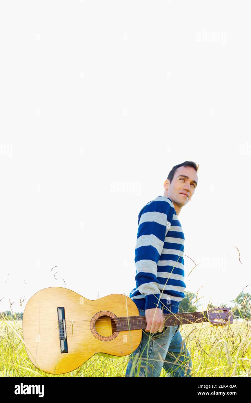 Man guitar over shoulder hi-res stock photography and images - Alamy