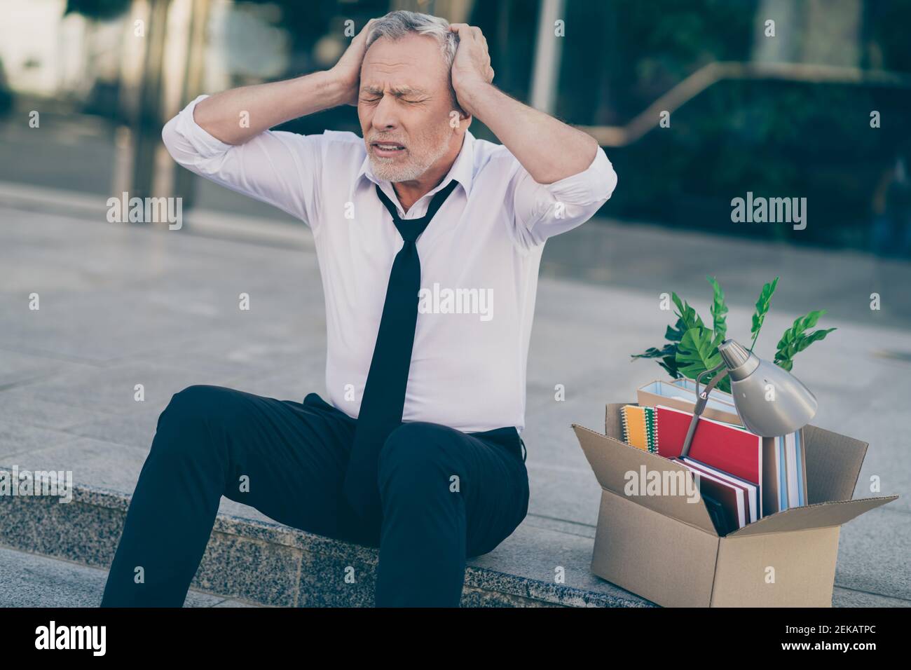 Photo of depressed hopeless elderly man hands head sit steps floor box ...