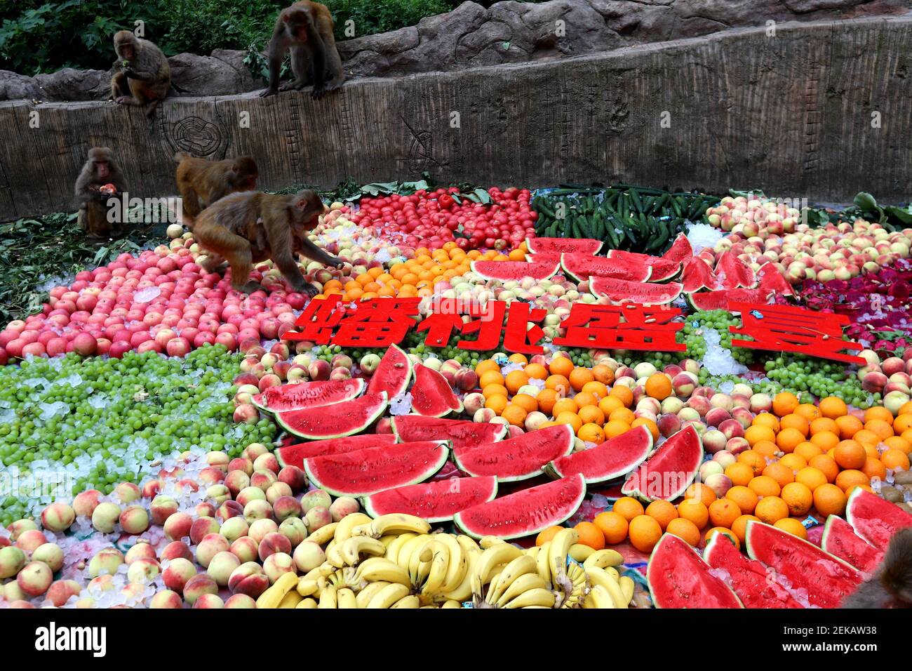 A staff dressed as the Monkey King arranges a feast of various iced ...