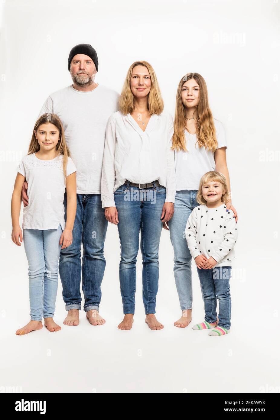 Happy family against white background in studio Stock Photo - Alamy