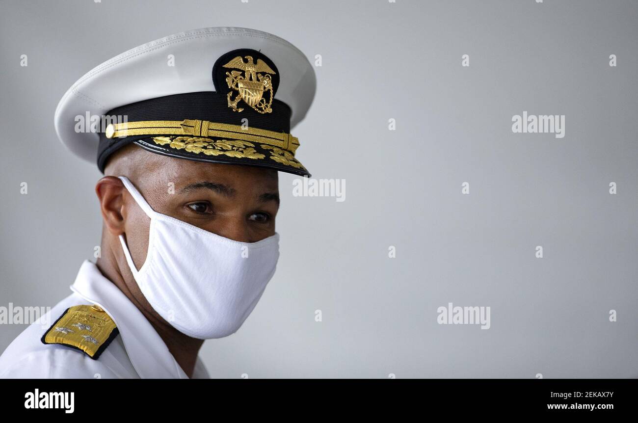 Vice Admiral Jerome Adams, the U.S. Surgeon General, looks on at the ...