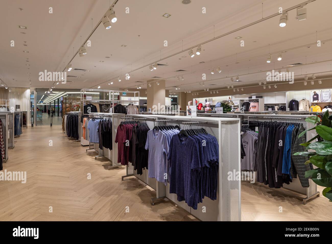 Clothes rack in shopping center Stock Photo - Alamy