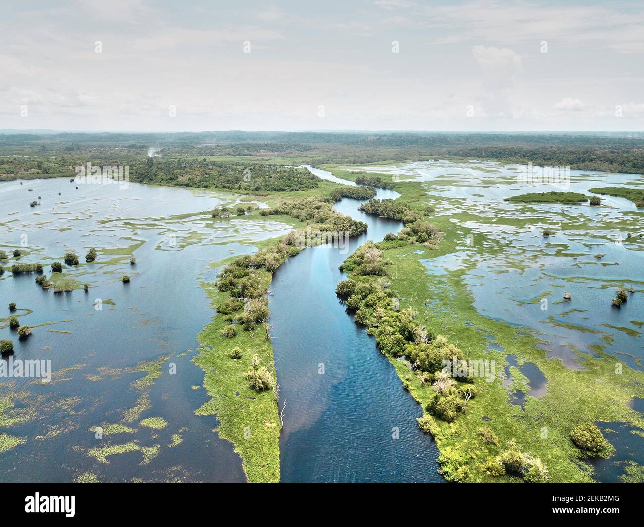 Ivory Coast, Sassandra, Aerial view of lagoons with clear line of ...