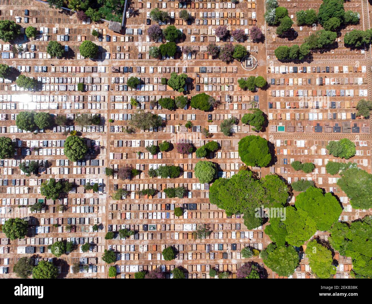 Scenic aerial flight directly above densely packed cemetery graveyard ...