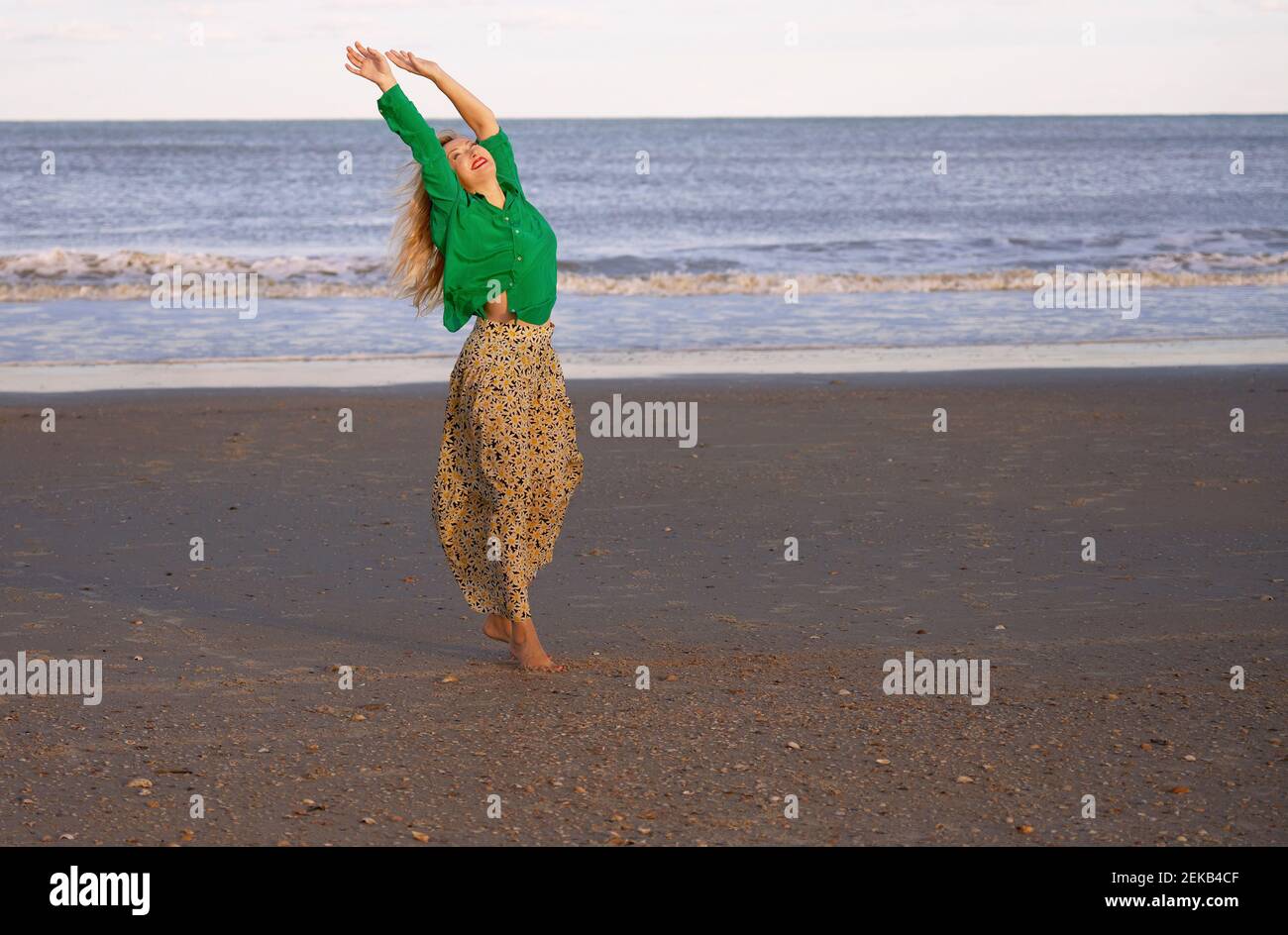 Woman dancing on beach hi-res stock photography and images - Alamy
