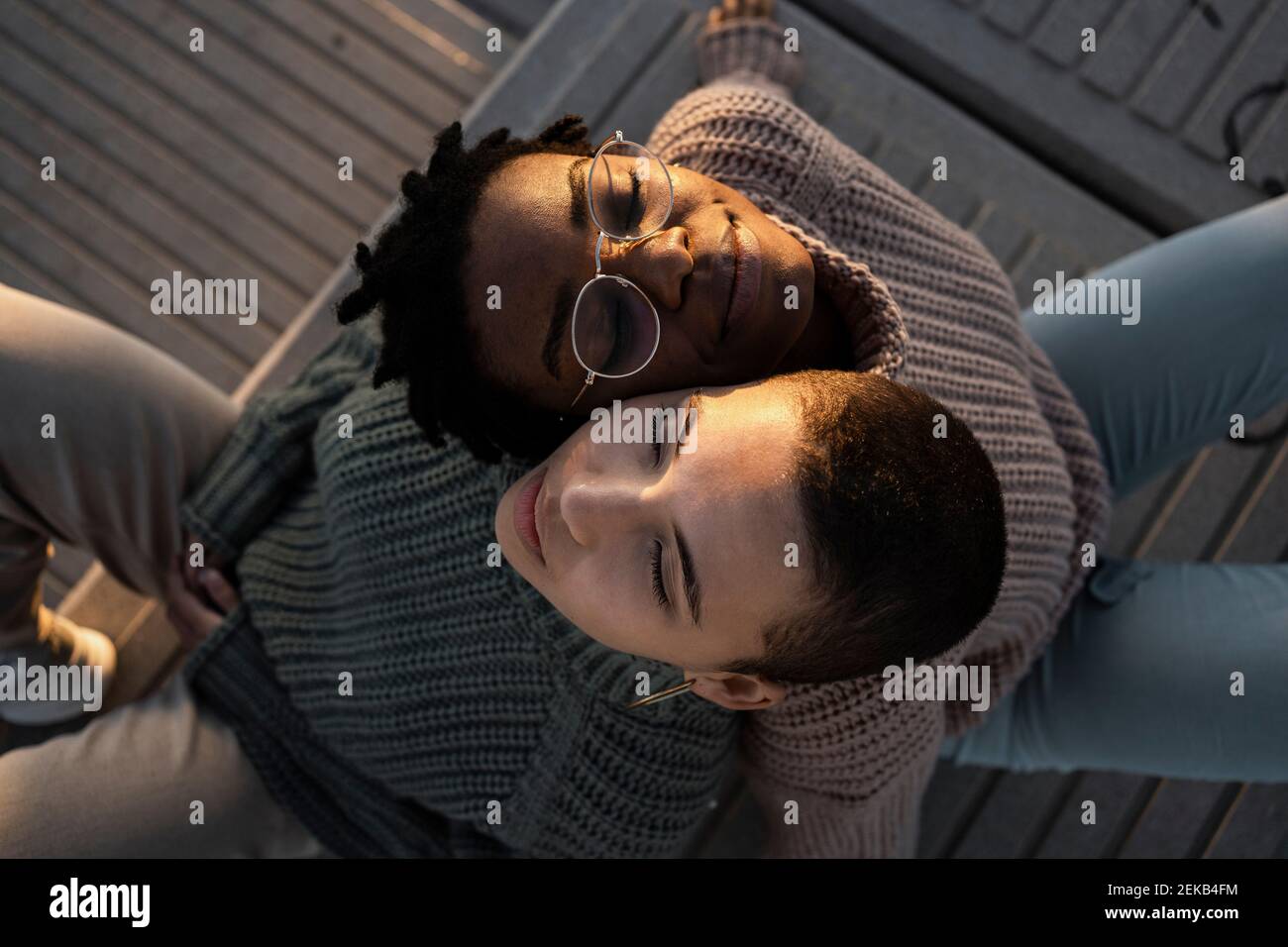 Women friends leaning on each other hi-res stock photography and images ...