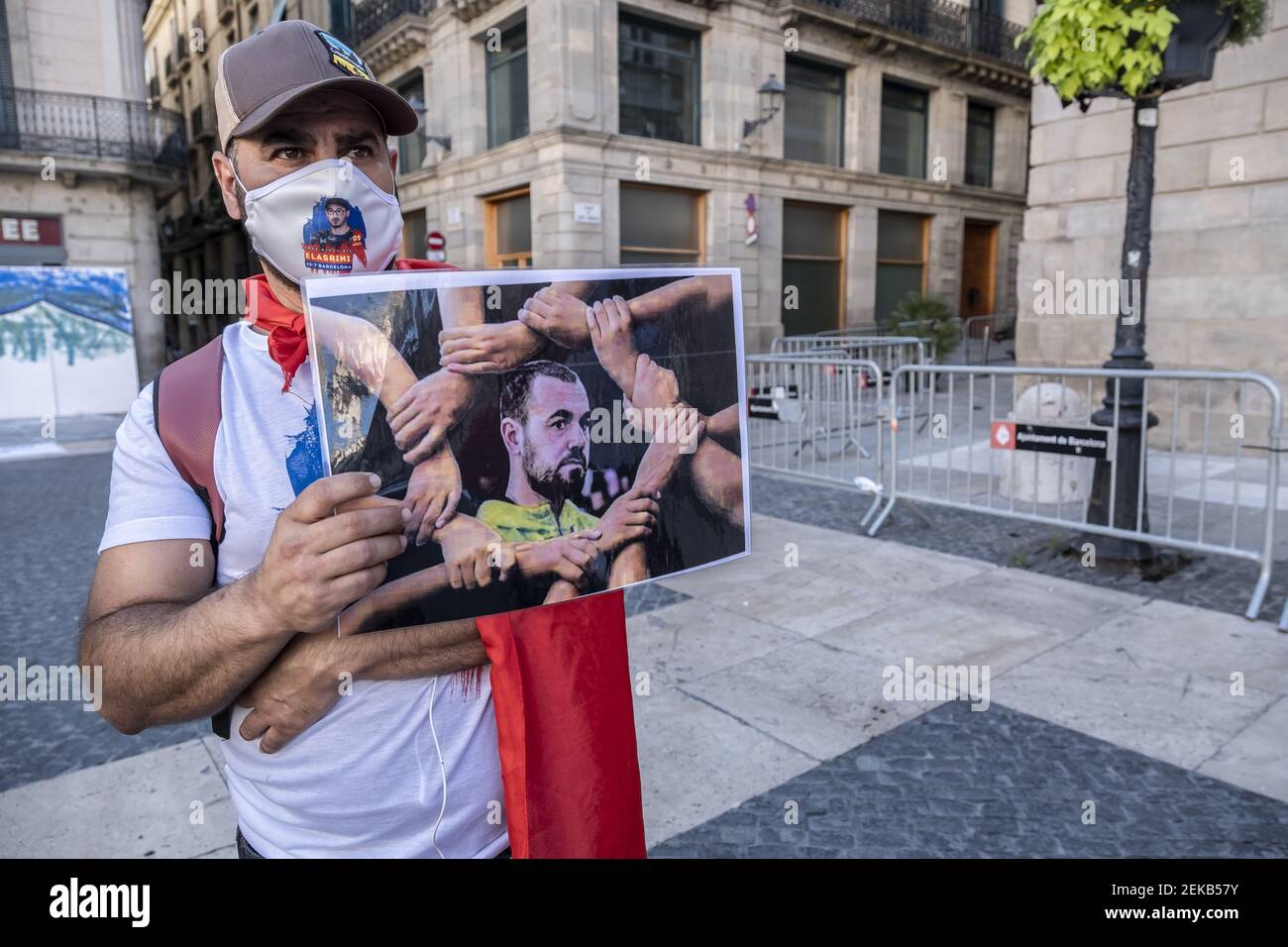 A supporter of the Popular Rif Movement (Hirak) wearing a mask is seen ...