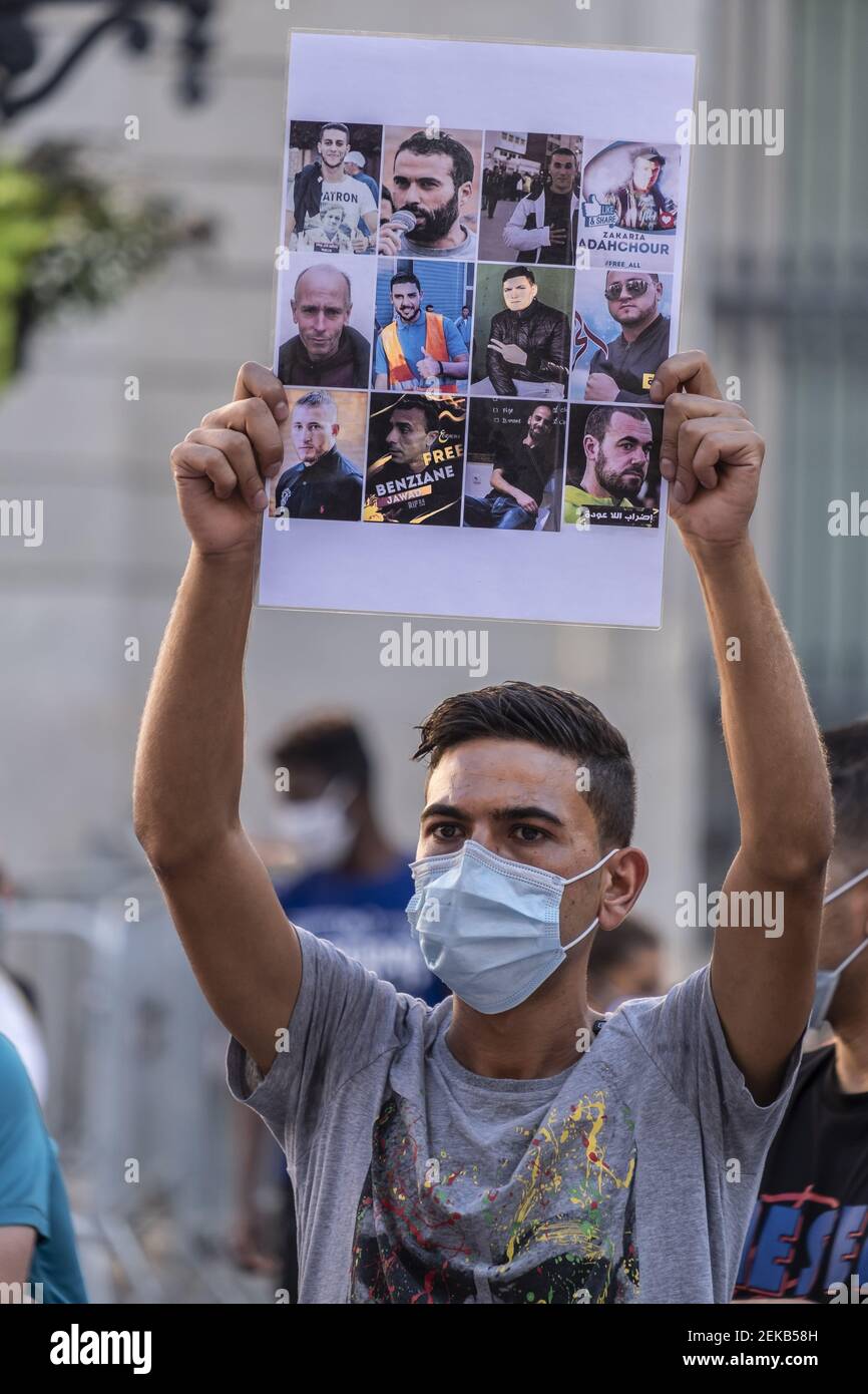 A supporter of the Popular Rif Movement (Hirak) wearing a mask is seen ...