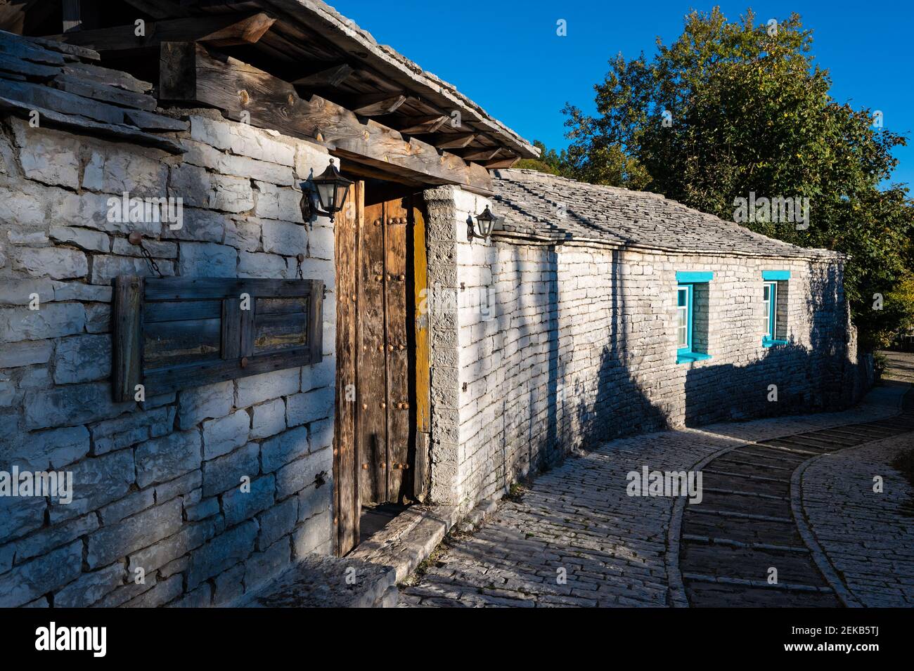 Stone houses of traditional architecture and cobble-stone narrow street ...
