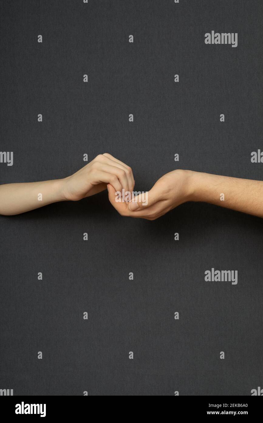 Studio shot of male and female hand touching each other Stock Photo - Alamy