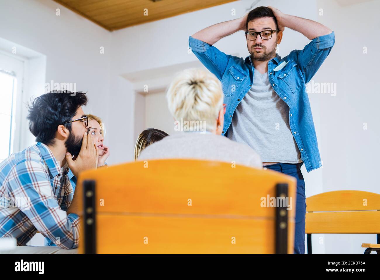 Bad day at job. Young sad man being fired from his job Stock Photo - Alamy