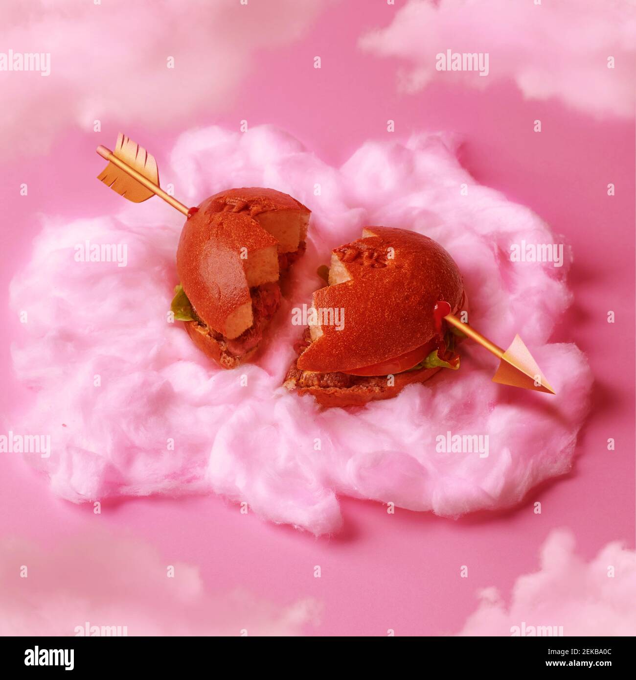 Burger in the shape of a heart. Broken heart. Street food. Arrow in a ...