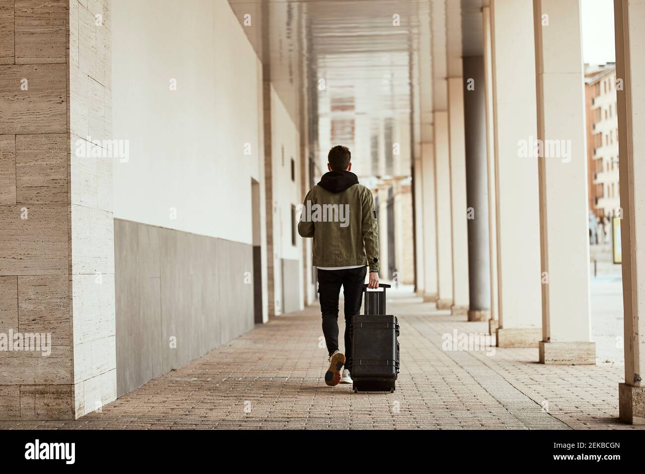 Person tourist pulling suitcase hi-res stock photography and images - Alamy