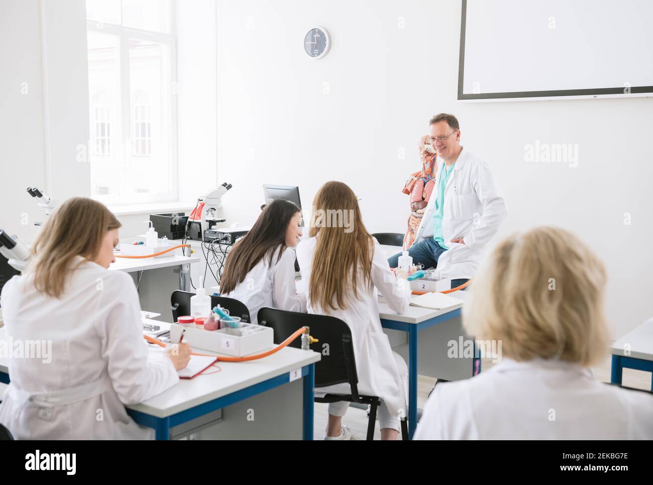 Students having lecture with professor in science lab classroom Stock ...